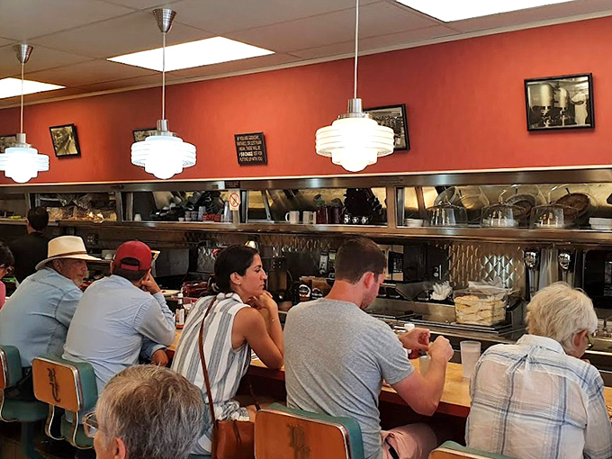 Counter seating: where solo diners become regulars and servers know your order before you sit down.