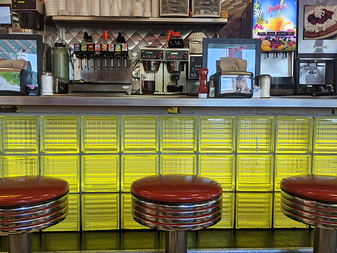 The entrance pathway to breakfast nirvana, where Arizona palm trees stand guard over one of Chandler's most cherished culinary institutions.