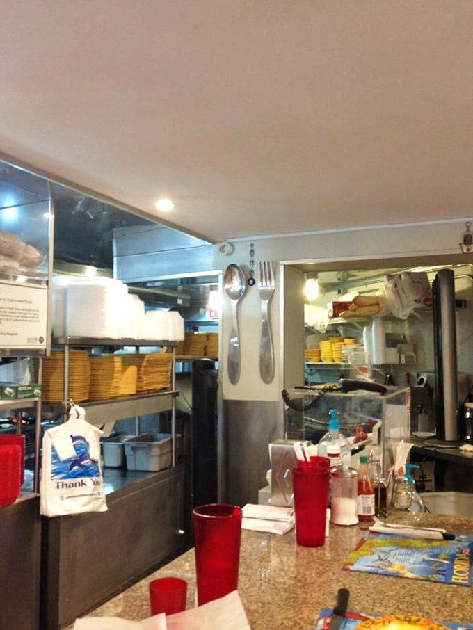 The heart of the operation. Red cups stand sentinel at a counter that's witnessed thousands of first bites and the smiles that inevitably follow.