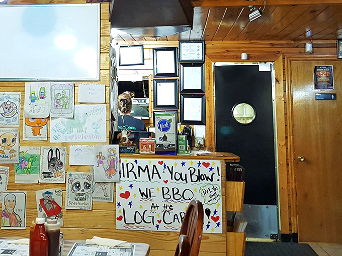 The wall of children's drawings and handmade signs tells you everything—this isn't just a restaurant, it's a beloved community landmark.