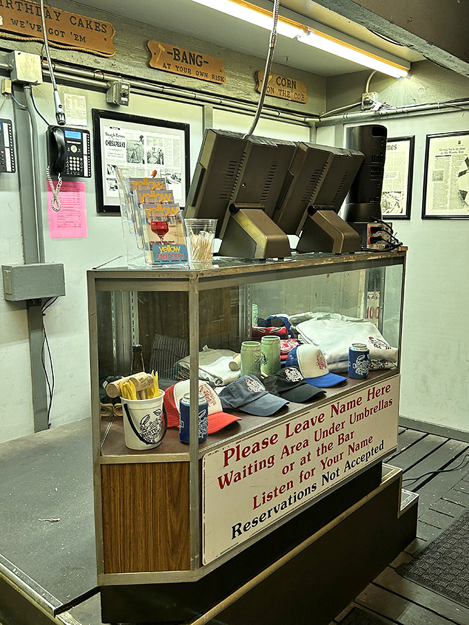 The host stand's handwritten sign says it all: "Please Leave Name Here"&mdash;a refreshingly analog touch in our digital world.