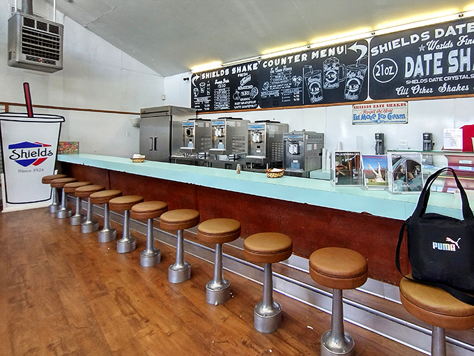 The classic counter seating invites you to belly up for a shake, where the stools have supported date enthusiasts for generations.
