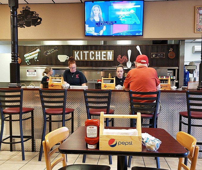 Counter seating: where solo diners become temporary neighbors and the ketchup bottle passes between strangers who bond over perfectly crispy hash browns.