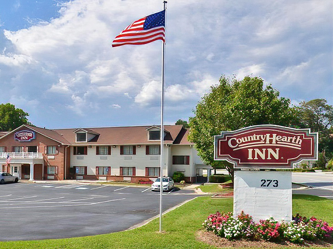 The Country Hearth Inn flies Old Glory with pride against Georgia's blue skies. Unpretentious lodging where the welcome mat is always out.