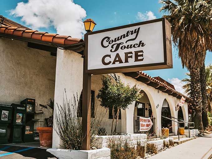 Country Touch Cafe embodies its name with a palm-tree-adjacent patio that whispers, "Sit a spell, the rat race is miles away."