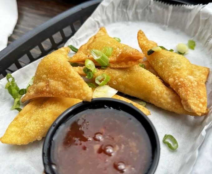 These golden crab rangoon triangles aren't just appetizers&mdash;they're crispy little envelopes delivering messages of joy straight to your soul.