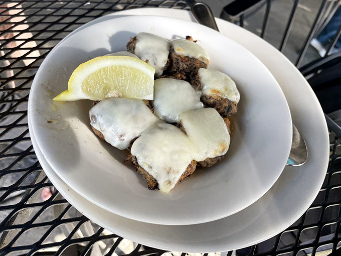 Crab-stuffed mushrooms under a blanket of melted cheese with a squeeze of lemon&mdash;little umami bombs that disappear from the plate mysteriously fast.