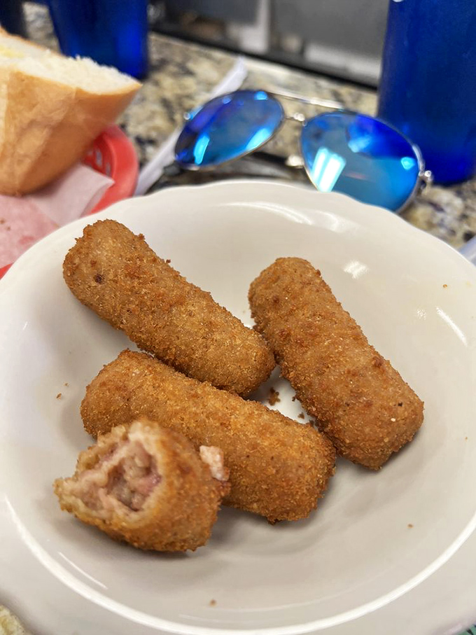 Ham croquettes that crunch on the outside and melt inside, like edible golden nuggets filled with creamy, savory Cuban comfort.