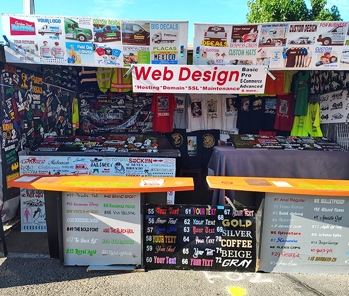This booth offers one-stop shopping for your digital and physical identity&mdash;web design with a side of custom t-shirts is peak 21st century flea market.