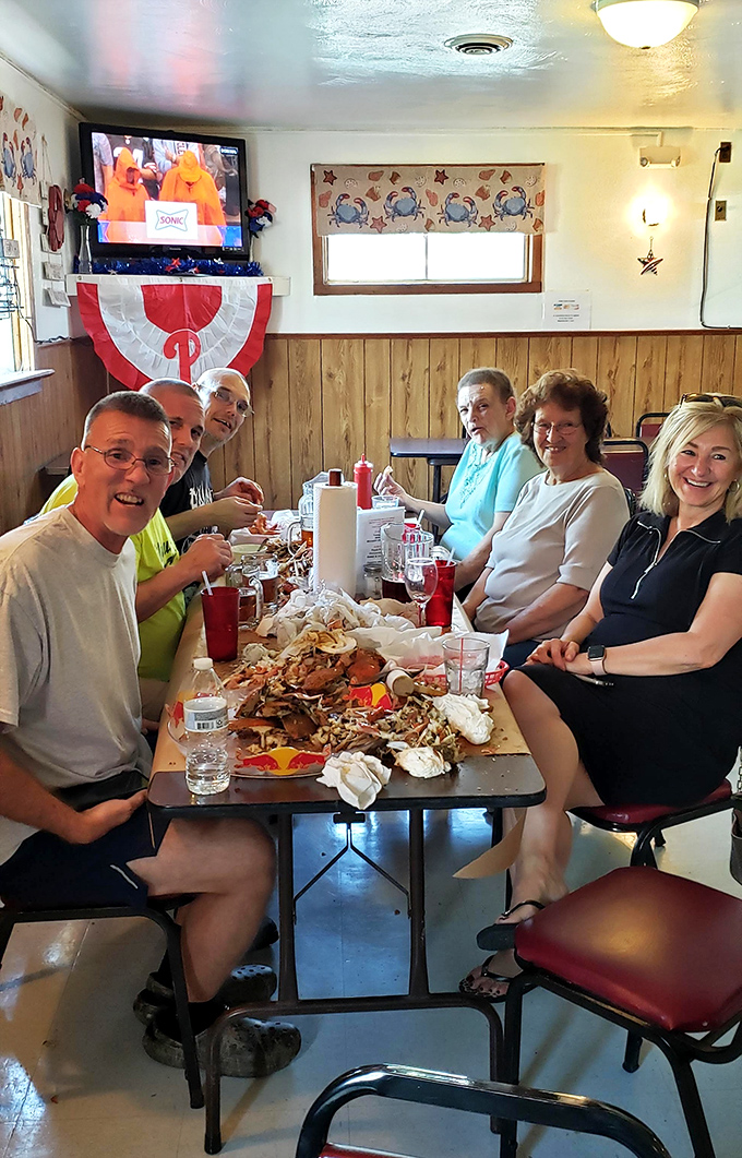 The true measure of a seafood joint: locals who know how to dismantle a pile of crabs with surgical precision and unbridled joy.