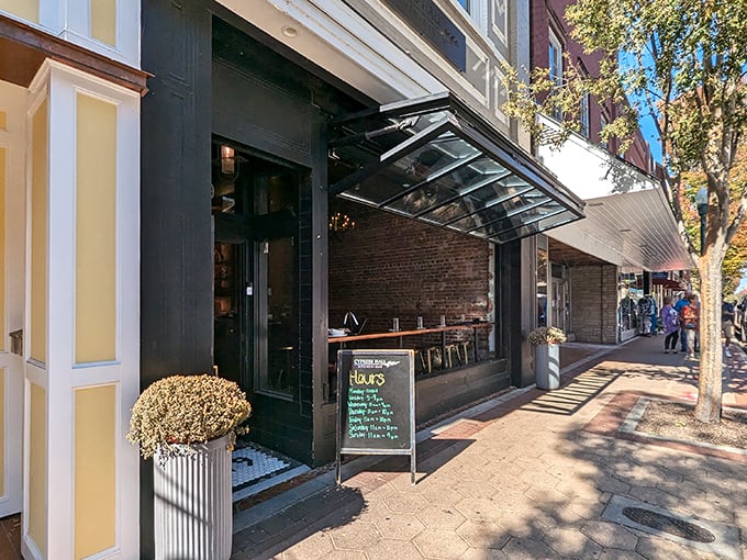 Downtown storefronts bathed in afternoon light create that perfect small-town tableau where you half-expect Jimmy Stewart to walk around the corner.