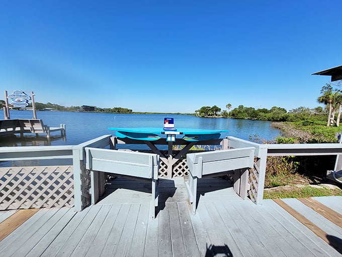 Waterfront dining with a view that no interior designer could replicate. Mother Nature showing off with that perfect blue Florida sky.