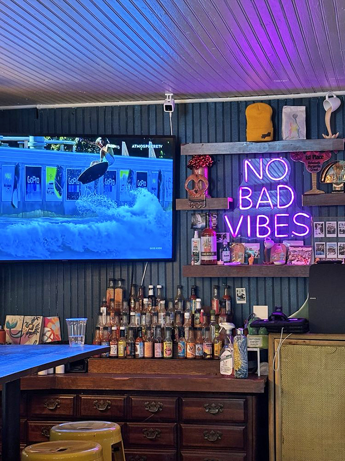 The bar area's pink-purple glow transforms evening drinks into a scene from your favorite indie film&mdash;casual cool without trying too hard.