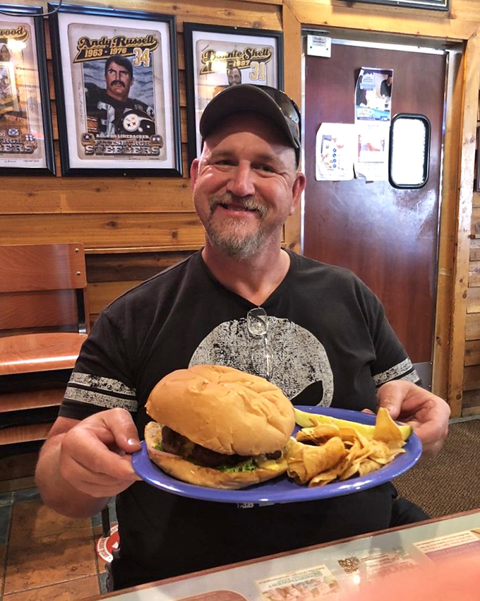 The face of a man who's about to embark on a delicious journey. That burger isn't just a meal&mdash;it's a memory in the making.
