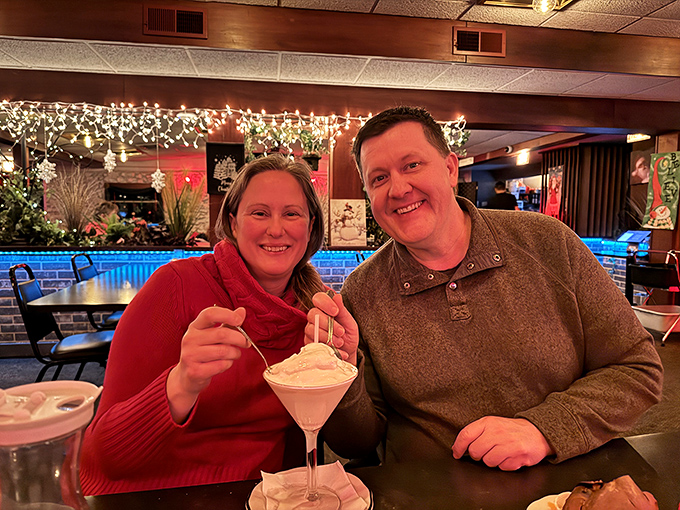 The image shows patrons enjoying what appears to be a dessert drink, capturing the convivial atmosphere that makes supper clubs special gathering places.