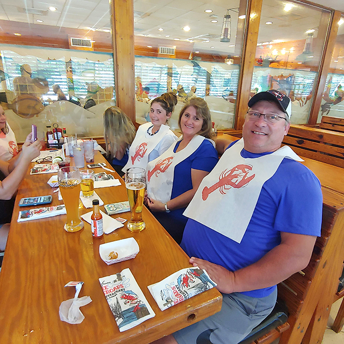 Dining with a view of fellow seafood enthusiasts. Those lobster bibs aren't just practical&mdash;they're the unofficial uniform of serious eaters.