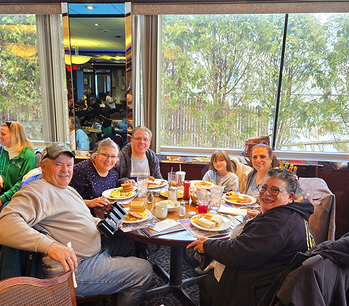 The true measure of a great diner: tables filled with smiling faces sharing good food and better conversation in sunlight-drenched comfort.