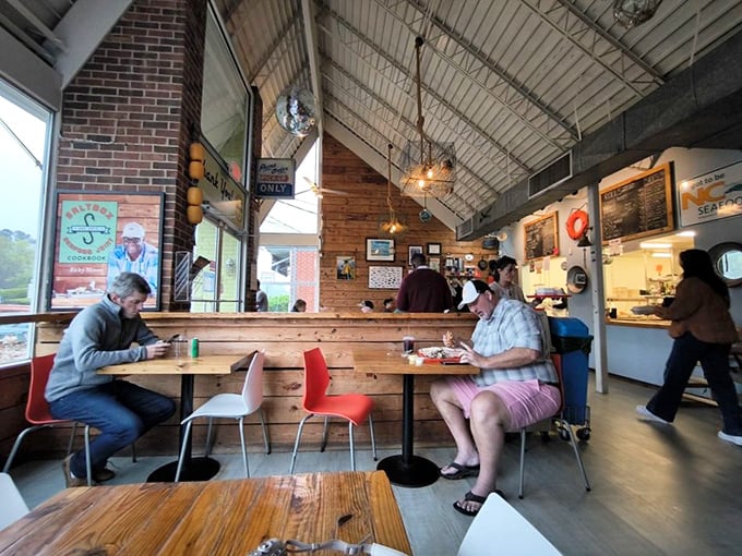 Diners lost in seafood reverie, experiencing that rare restaurant silence that only happens when the food demands complete attention.