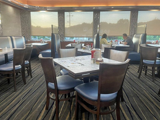 Blue and white booths create the perfect backdrop for countless conversations, first dates, and the occasional "we need to talk" moment.