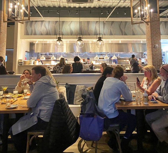 The open kitchen design isn't just for show &ndash; it's dinner and a performance where every plate is the star.