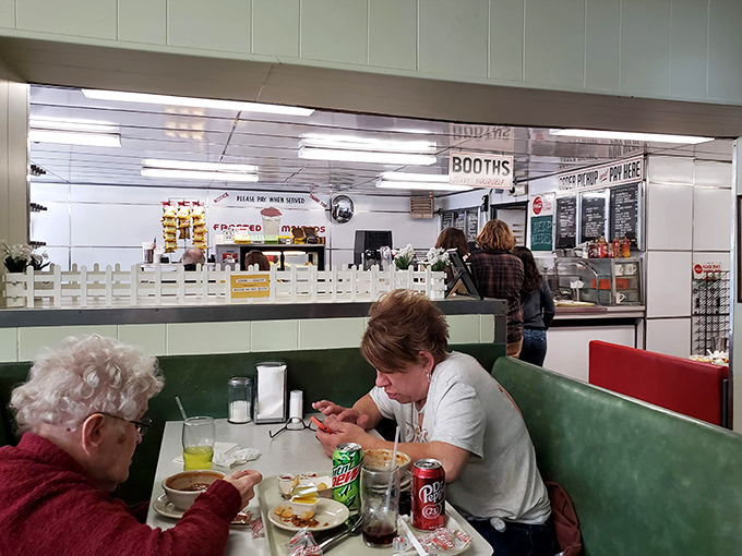 Where farmers in work boots sit next to business professionals in suits, united by the universal language of good food served without pretension.