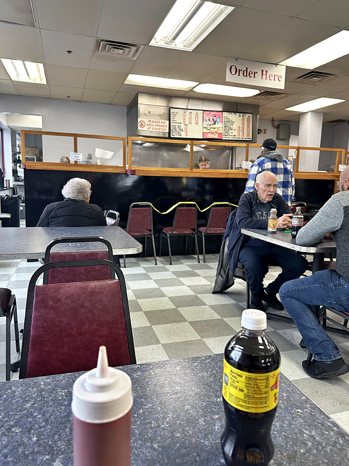 Lunch counter community in action&mdash;where strangers become friends over shared appreciation for great food.