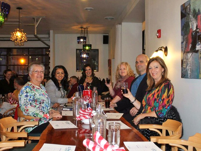 The true measure of an Italian restaurant: tables filled with people talking with their hands, wine flowing, and not a phone in sight.