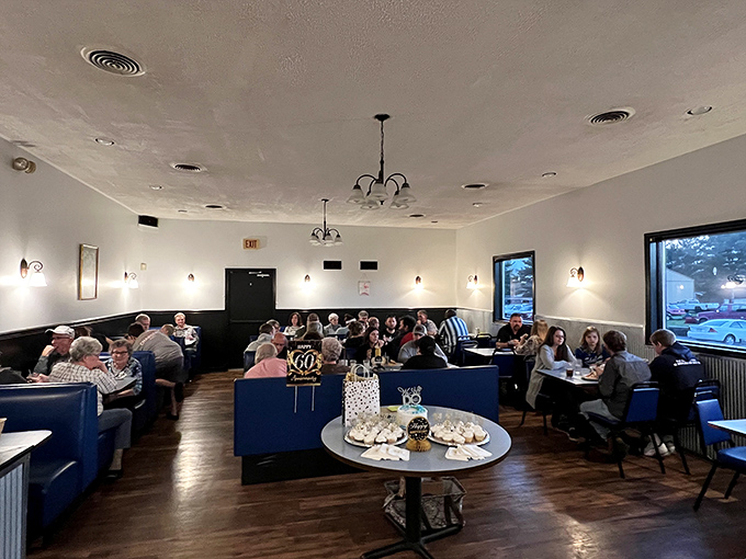A dining room where strangers become neighbors over coffee refills and shared appreciation for proper breakfast technique.