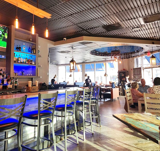 The dining room buzzes with the universal language of "mmm" as patrons discover why people drive across state lines for these seafood treasures.