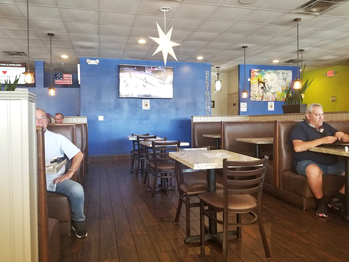 Blue walls and comfortable booths create the perfect backdrop for morning conversations that range from weather updates to solving world problems.