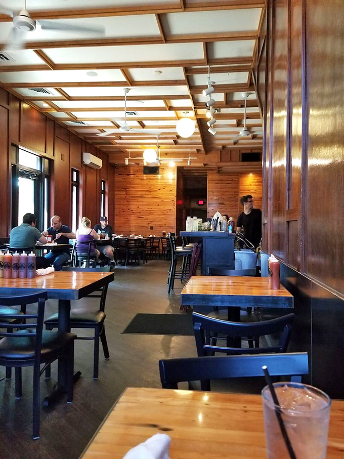 Where strangers become friends over shared plates and the universal language of "mmm" echoes through wood-paneled walls.