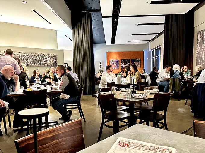 The dining room hums with conversation and clinking glasses. Notice how nobody's looking at their phones? That's the power of truly good food.
