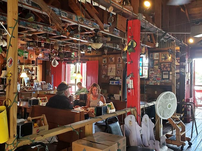 The dining room doubles as a museum of coastal curiosities. Every meal comes with a side of conversation starters hanging from the rafters.