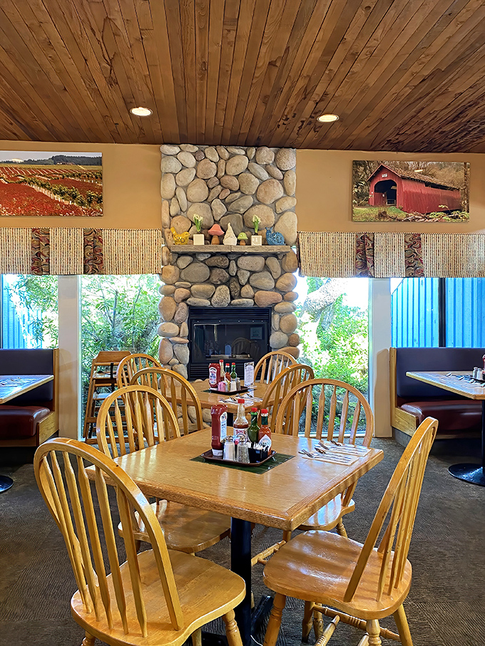 Stone fireplace, wooden chairs, and country-style decor create the perfect backdrop for comfort food that tastes like someone's grandmother made it.