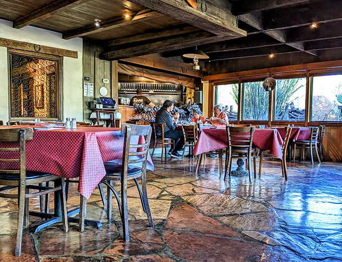 Stone floors and wooden beams frame a dining room where red checkered tablecloths signal you're in for honest, unpretentious food. No molecular gastronomy, just molecular deliciousness.