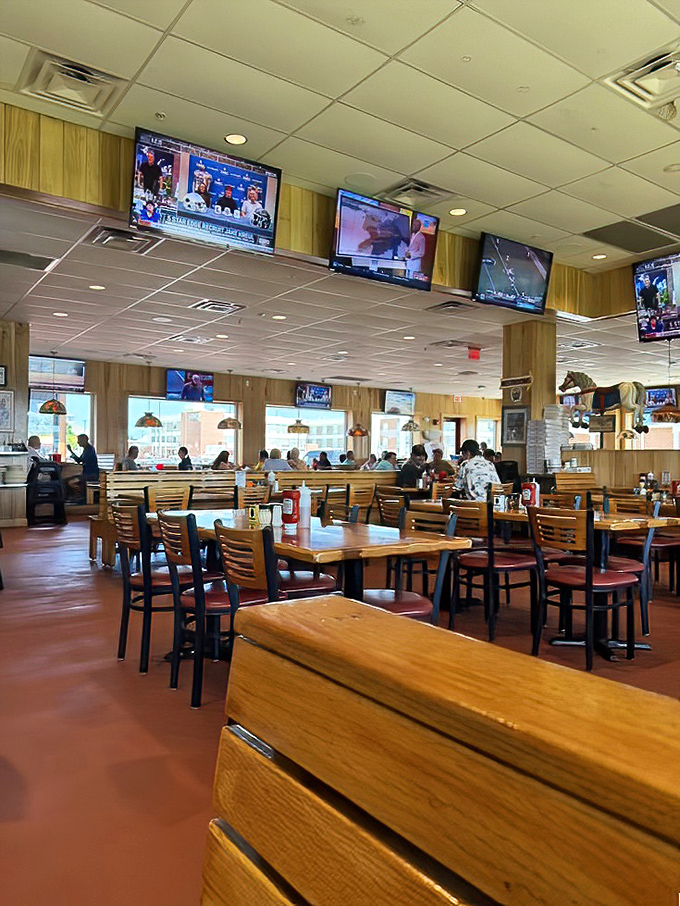 Modern meets comfort in this updated dining space where TVs and tradition peacefully coexist like old friends.