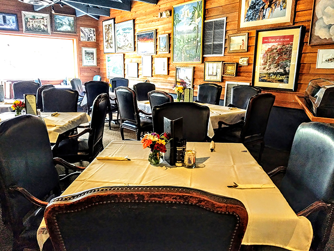 White tablecloths and comfortable seating surrounded by walls of local art&mdash;casual elegance that says "take your time, stay awhile."