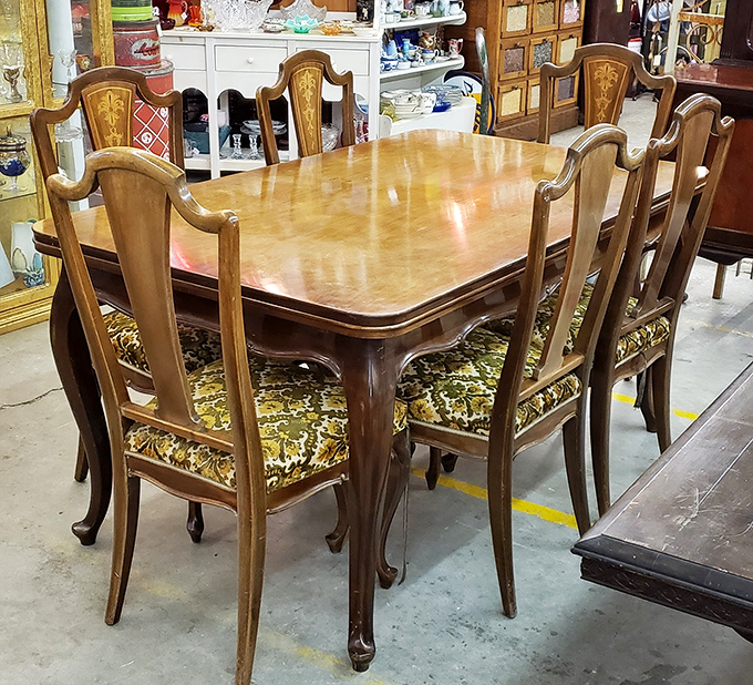 Dinner parties were serious business when this set was new. Those high-backed chairs have witnessed countless holiday meals and family disagreements.