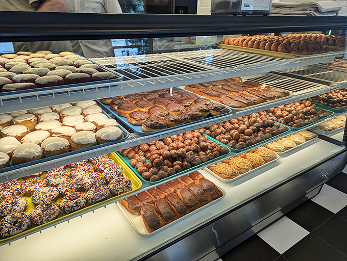 The display case &ndash; a museum of edible art where sprinkles, glazes, and fillings compete for your attention and willpower goes to die.