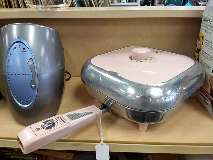 Vintage kitchen appliances that remind you of grandma's Sunday dinners. That pink electric skillet has definitely seen some legendary pancake breakfasts.