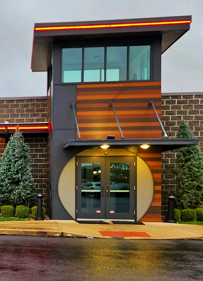 The distinctive entrance with its circular doorway and wood accents invites you into a world where steak is king and comfort reigns.