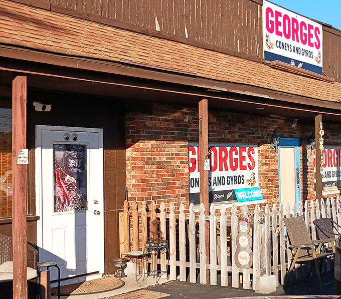 The entrance beckons with promises of comfort food and a white picket fence that says "this place takes its hot dogs seriously."