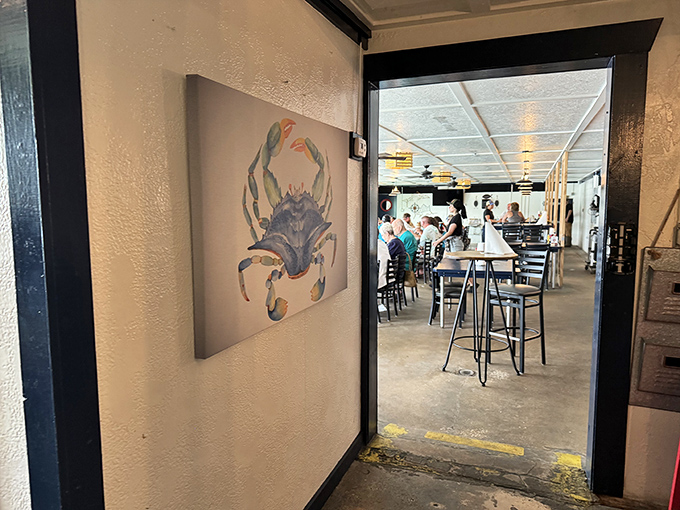 The blue crab artwork guards the entrance like a delicious sentinel &ndash; a hint of the ocean treasures waiting just beyond this doorway.