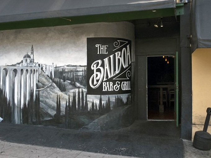 The entrance mural pays homage to San Diego's iconic park, reminding you that great food is always rooted in a sense of place.