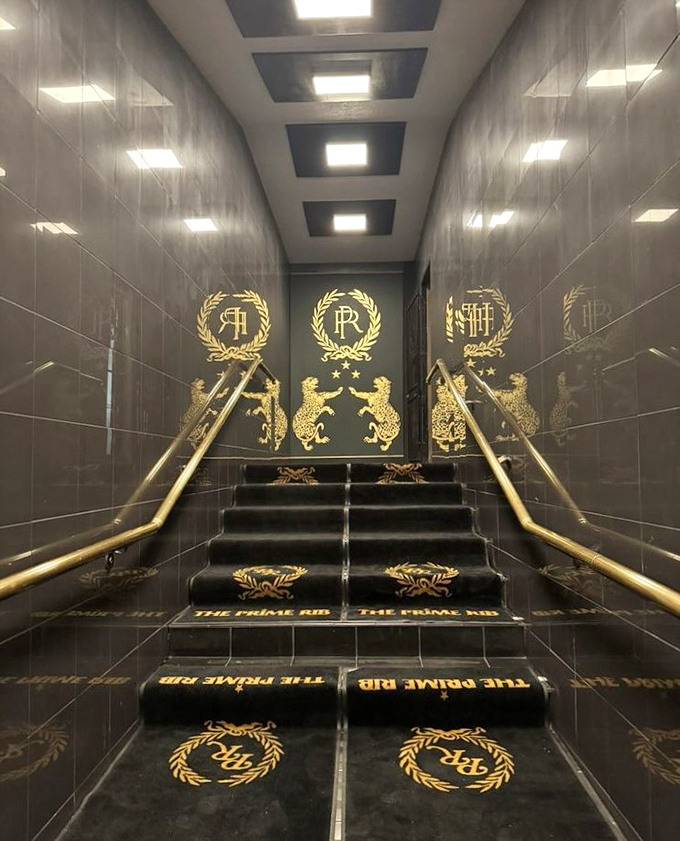 The entrance stairway announces your arrival in style. These gold-accented steps, emblazoned with the restaurant's logo, are the perfect prelude to the elegance that awaits above.