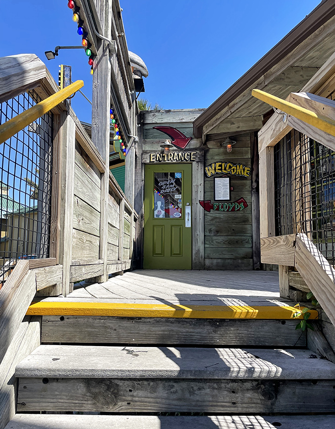A weathered wooden entrance with colorful accents &ndash; like walking into a friend's beach house, if your friend happened to serve unlimited shrimp.