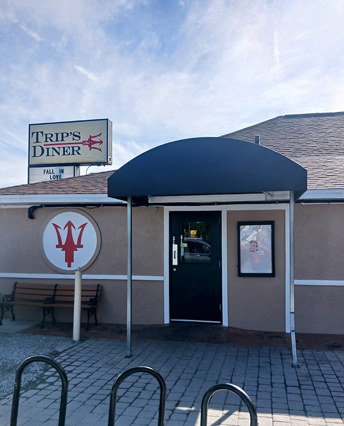 The entrance with its distinctive trident logo invites you to "FALL IN LOVE" – and they're not just talking about the menu.