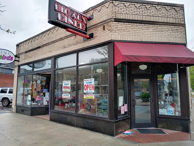 Not all heroes wear capes—some wear red awnings and promise "OPEN" signs when you need them most. The morning beacon of Larchmere Boulevard.