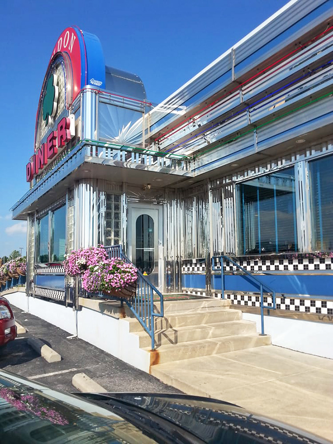 Flower baskets add a touch of color to the gleaming stainless steel exterior. Even the architecture says "come in, stay awhile."