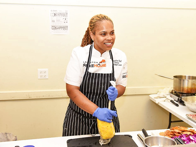 Skilled hands make all the difference. The chef's focused expression tells you everything about the care that goes into each dish.